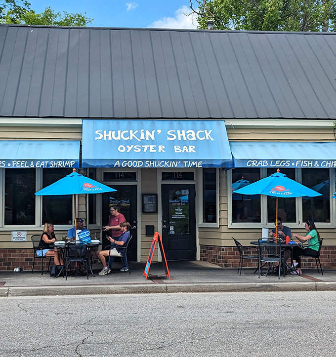 The blue awning promises "A GOOD SHUCKIN' TIME" – and folks, that's truth in advertising if I've ever seen it.