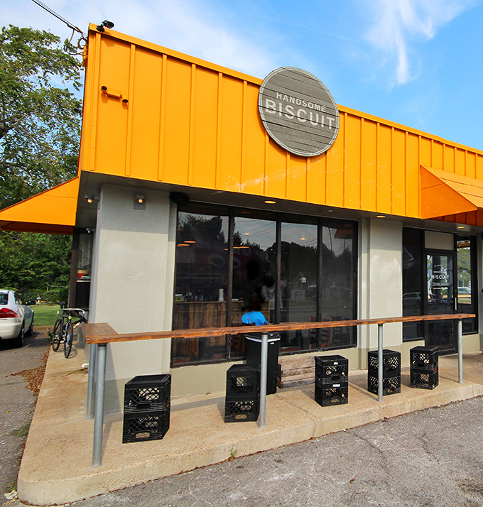 The bright orange exterior of Handsome Biscuit stands out like a culinary lighthouse, beckoning hungry travelers to the shores of breakfast bliss.