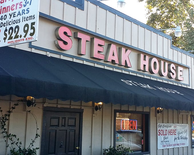 The iconic red lettering of Gus's Steakhouse beckons hungry travelers like a culinary lighthouse in Sonora's Gold Country. A promise of comfort awaits.