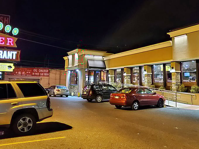 The golden glow of Oregon Diner's exterior at night—a South Philly lighthouse guiding hungry souls to breakfast paradise.