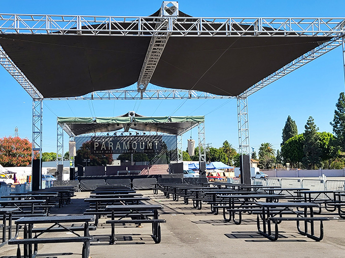 The Paramount Entertainment Center's covered seating area awaits the weekend rush. Soon these benches will host tired shoppers refueling with street tacos and bargain tales.