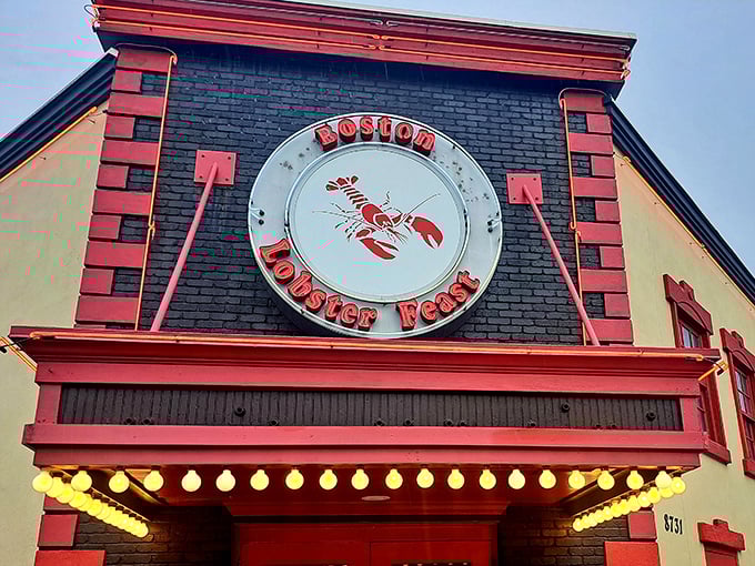 The iconic façade of Boston Lobster Feast stands like a lighthouse for seafood lovers, beckoning hungry travelers with its unmistakable lobster sign.