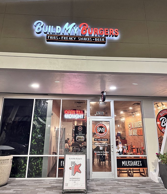 The neon glow of Build My Burgers beckons like a lighthouse for the hungry. Open till midnight for those emergency burger situations we all face.