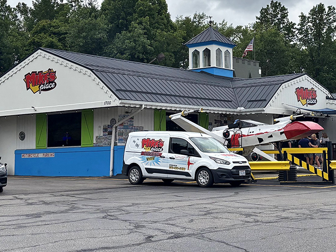 Yes, that's an actual airplane on the roof! Mike's Place in Kent doesn't just serve food—it delivers a full-scale visual adventure before you even walk in. 