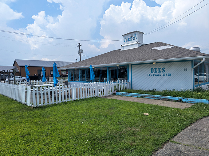 The classic white exterior with turquoise trim says it all—this isn't just a diner, it's a time machine with pancakes. Welcome to Dee's 50's Place.