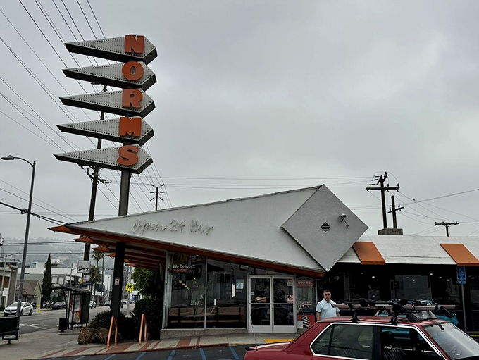 That iconic orange and white sign has been beckoning hungry Angelenos for generations—a neon lighthouse guiding the famished to safe harbor.