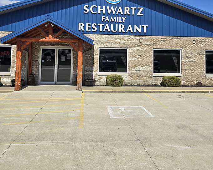 The blue-roofed beacon of Schwartz Family Restaurant stands proudly in Eckerty, promising comfort food worth the journey through Indiana's rolling countryside.