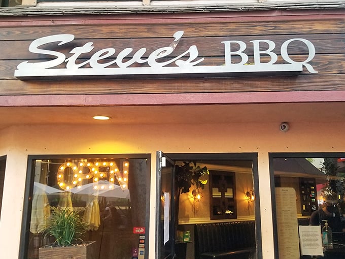 The wooden sign for Steve's BBQ promises simplicity, but inside awaits a complexity of flavors that will redefine your barbecue standards. 