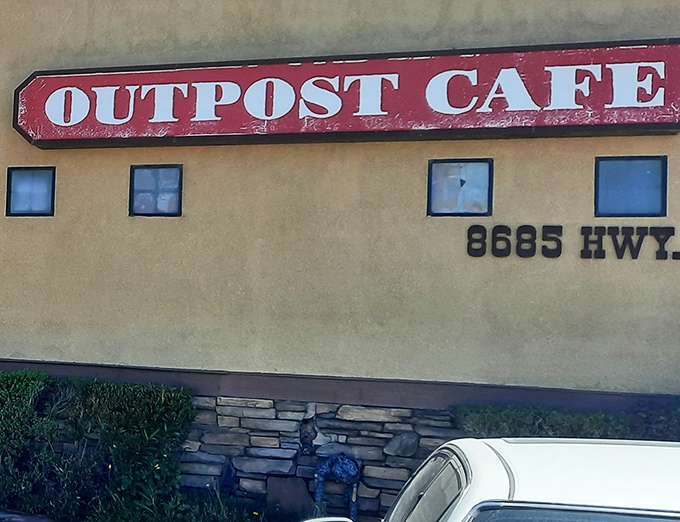 The iconic red sign beckons like an old friend against the desert sky—a promise of comfort food that's kept travelers returning for generations.