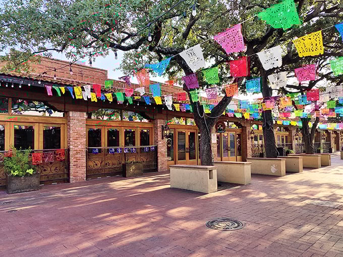 The colorful papel picado flags dancing above Mi Tierra's entrance aren't just decoration—they're a promise that joy awaits inside this San Antonio landmark.
