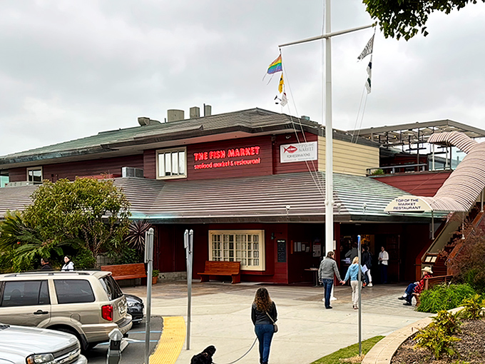 The Fish Market's nautical exterior stands like a welcoming lighthouse for hungry seafood pilgrims. Those flags aren't just for show—they're signaling "fresh catch ahead!"