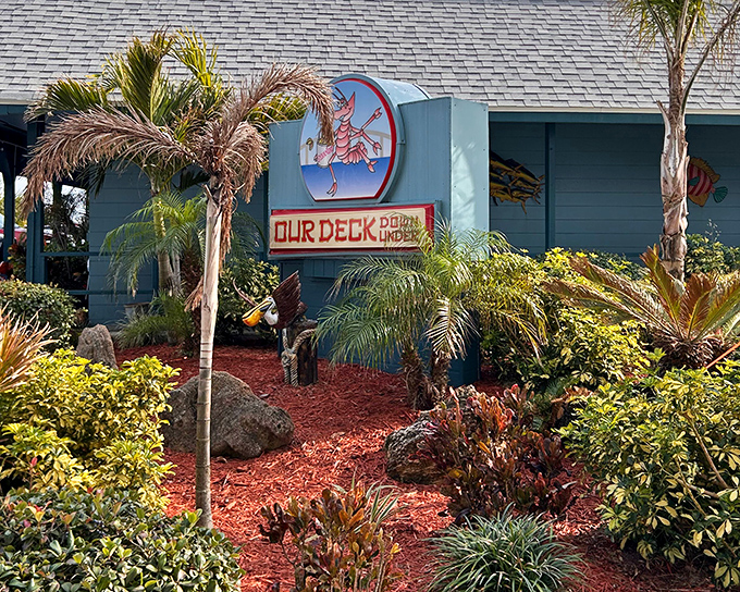 The tropical welcome mat! Our Deck Down Under's vibrant exterior promises Florida charm with its swaying palms and dancing lobster mascot.