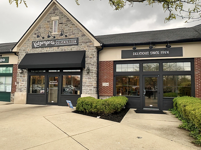 Katzinger's stone facade welcomes hungry pilgrims with the promise of delicatessen nirvana. That "Delicious Since 1984" sign isn't just marketing—it's a time-tested guarantee.