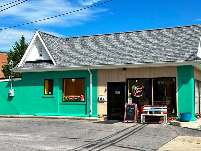 The turquoise beacon of Tropical Spice stands out like a Caribbean island dropped into the Virginia landscape, promising culinary adventures behind its modest façade.