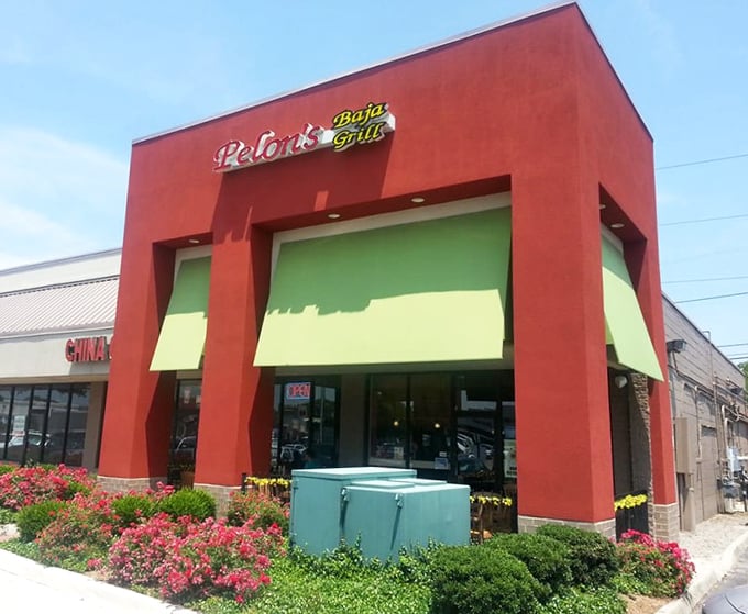 The vibrant red exterior of Pelon's Baja Grill stands out like a beacon of flavor, promising coastal Mexican delights inside this Norfolk hotspot.