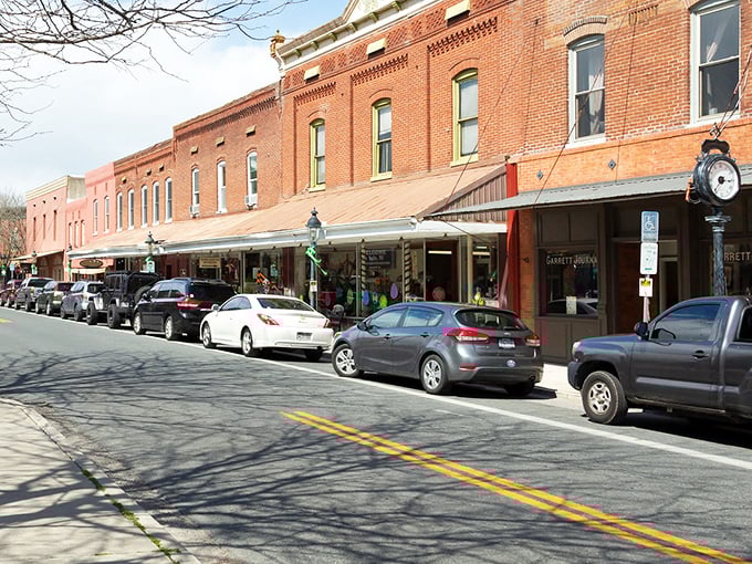 Main Street magic at its finest. These historic brick storefronts aren't just preserved—they're alive with shops that would make Norman Rockwell reach for his paintbrush.