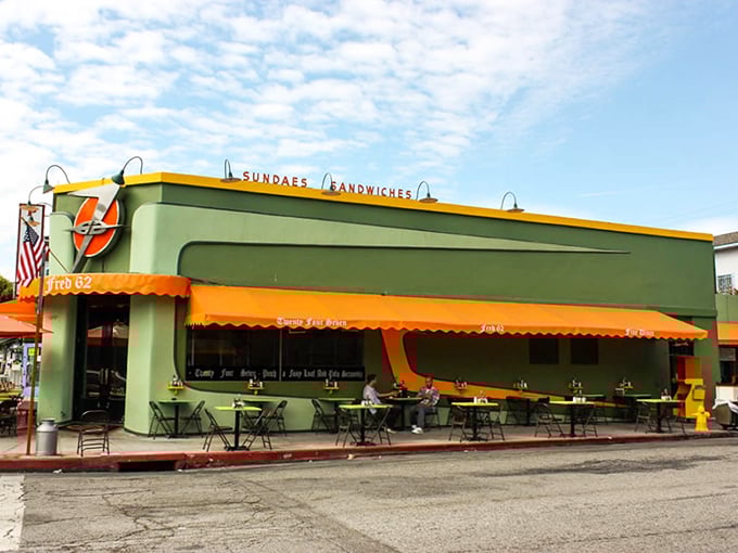 The mint-green exterior with orange awnings isn't just eye-catching—it's a beacon of hope for hungry souls wandering Vermont Avenue at any hour.