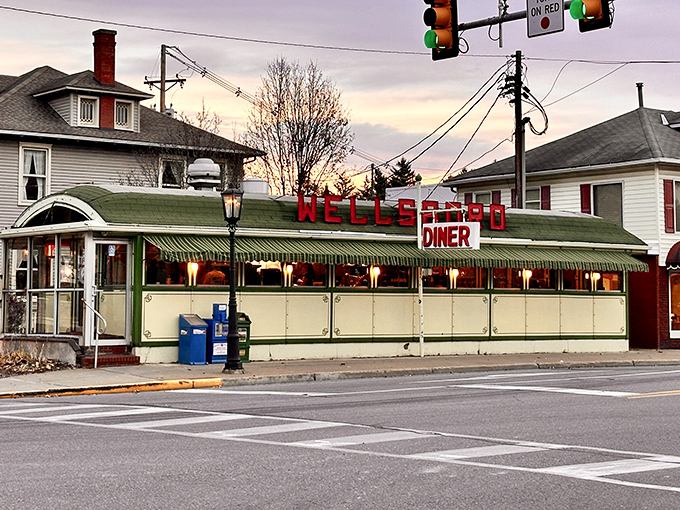 The gleaming stainless steel exterior of Wellsboro Diner isn't trying to be retro—it's the real deal, a genuine slice of Americana standing proudly on Main Street.