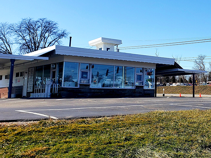 The classic white exterior of Dalton Dari-ette stands like a time capsule from simpler days, when drive-ins were America's culinary town squares.