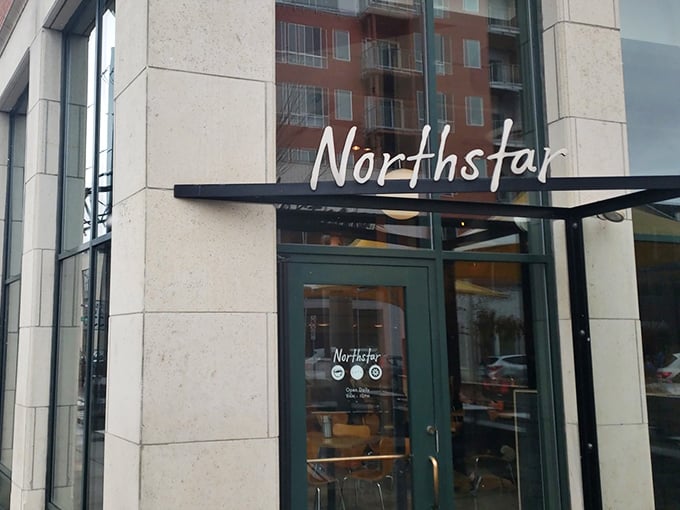 The sleek exterior of Northstar Cafe beckons like a culinary lighthouse in Columbus' Short North district, promising good things to those who enter.