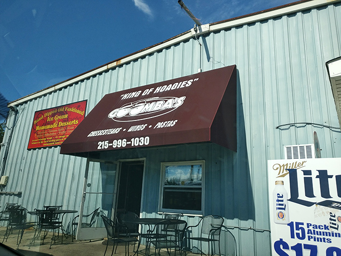 The unassuming blue exterior of Goombas proudly declares its royal status as "KING OF HOAGIES" – a bold claim that, as you'll discover, is absolutely justified.