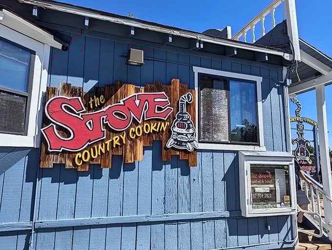 The blue cottage with the red sign isn't trying to be Instagram-famous—it's too busy being delicious. Mountain breakfast paradise found.