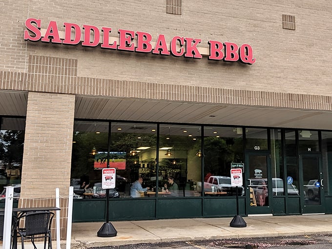 The unassuming brick exterior of Saddleback BBQ proves once again that the best barbecue joints don't need fancy facades—just follow your nose to the promised land.
