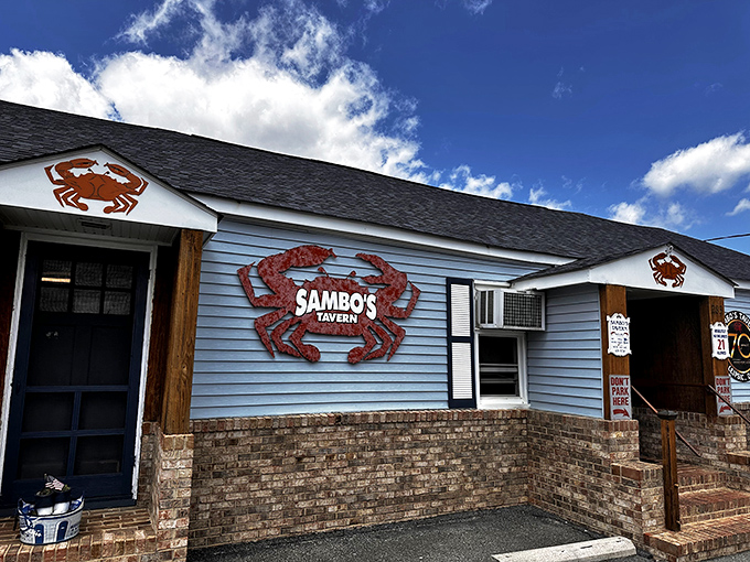 The unassuming blue clapboard exterior of Sambo's Tavern proves once again that culinary treasures often hide in plain sight.