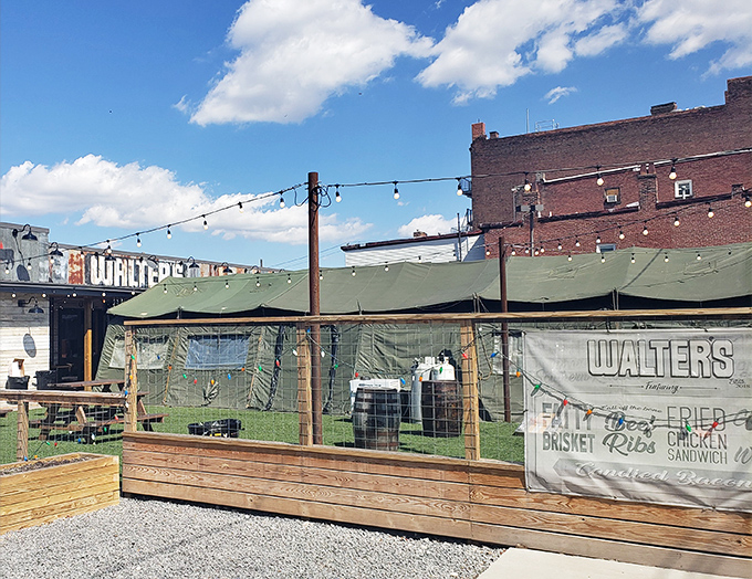 The unassuming exterior of Walter's Southern Kitchen promises no frills, just thrills for your taste buds. String lights and green awnings set the stage for BBQ magic.
