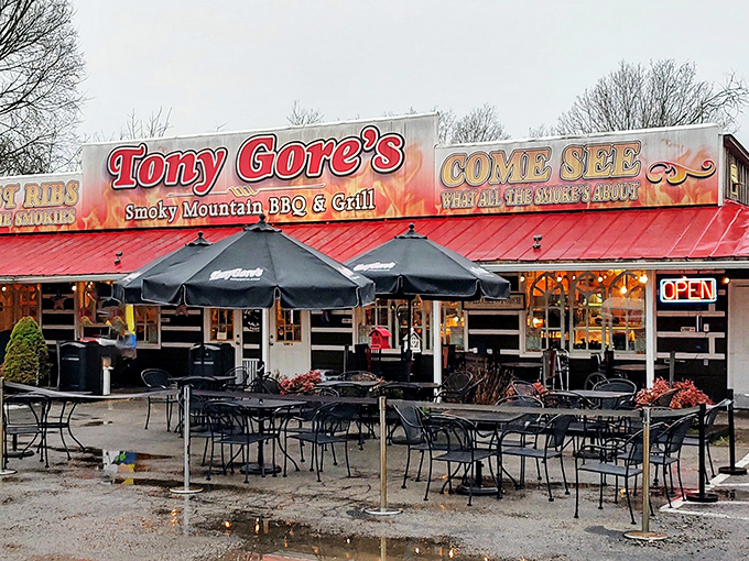 The flame-decorated signage isn't just for show—Tony Gore's red-roofed roadside haven delivers heat in both atmosphere and flavor.