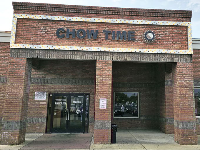 The unassuming brick exterior of Chow Time Buffet & Grill stands like a culinary fortress, promising treasures within that far exceed its modest façade.