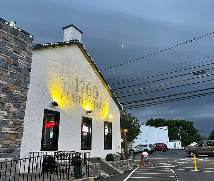 The unassuming white exterior of 1760 Pub N Grille hides culinary treasures within. Like Clark Kent's glasses, this modest facade conceals superhero-level cheesesteaks.