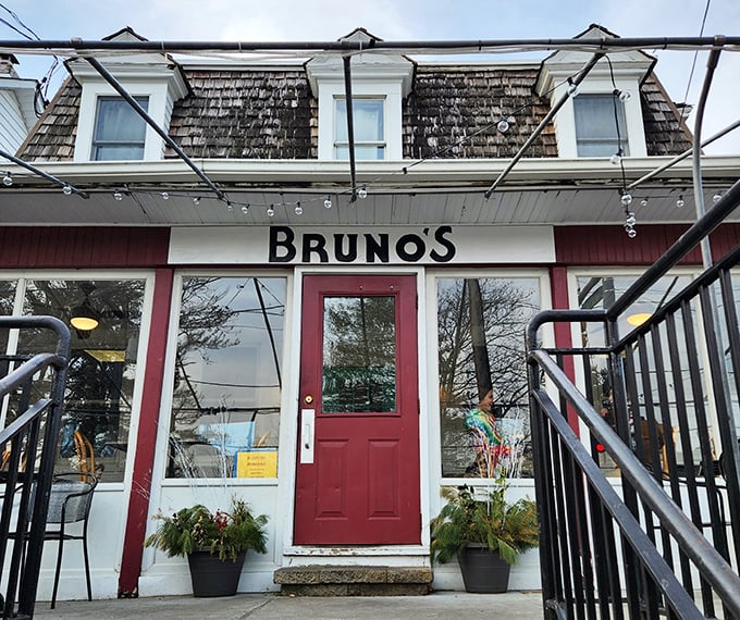 Bruno's charming exterior beckons with its red awnings and inviting porch – like a neighborhood friend waving you over for breakfast and good conversation.