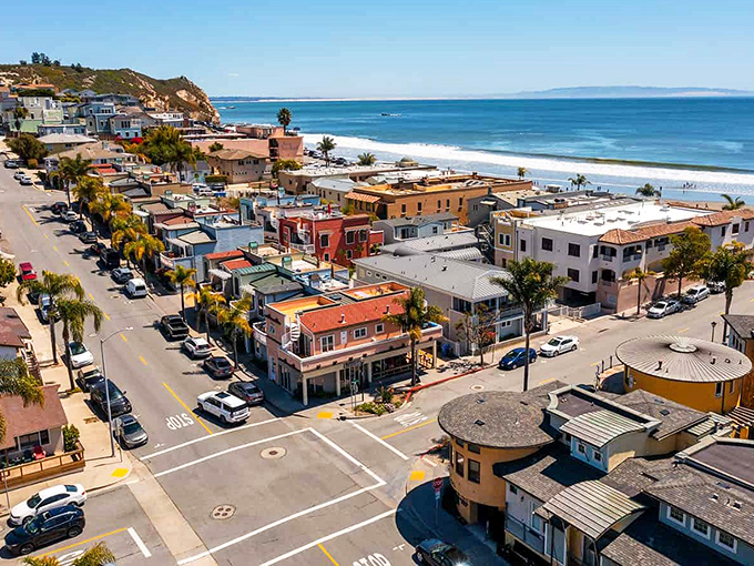 Avila Beach from above – where palm trees stand like exclamation points and the ocean whispers, "Slow down, you've arrived at California's best-kept coastal secret."