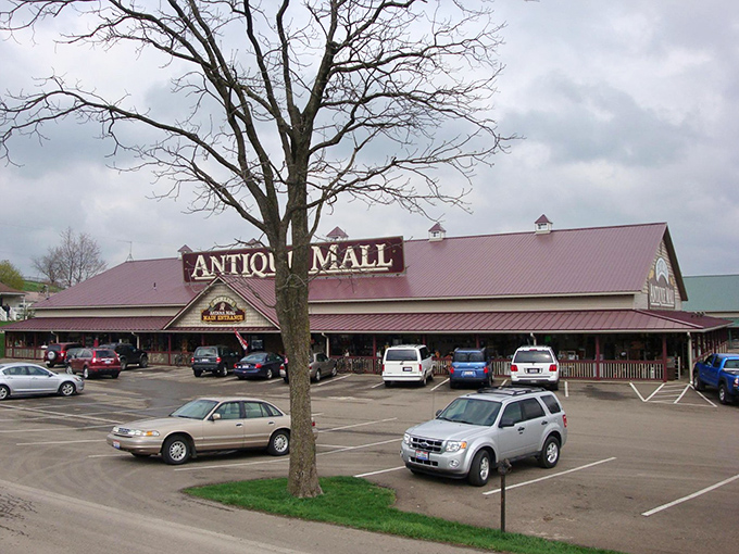 The rustic wooden facade of Berlin Village Antique Mall promises treasures inside like a book cover hints at adventures within.