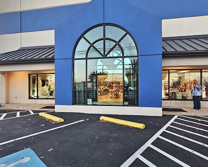 The blue and cream exterior of Re-Uzit Shop stands like a beacon of bargain possibilities, promising treasures within its welcoming doors.