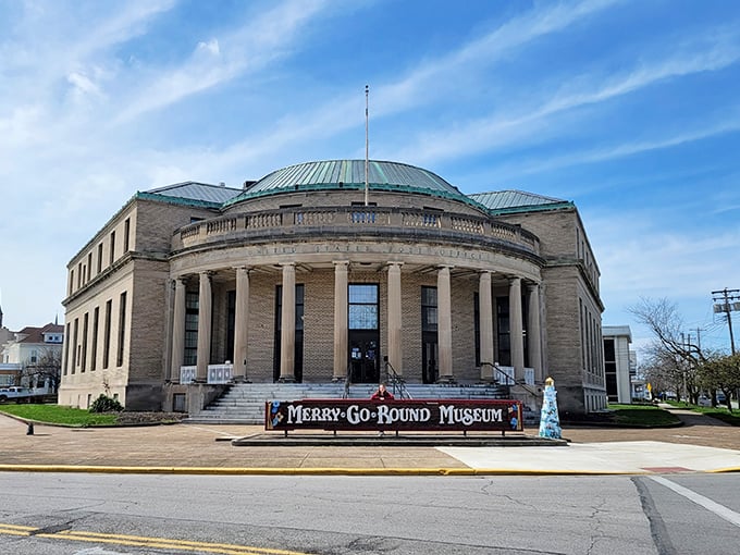The grand Neoclassical building houses whimsy instead of tax forms – a perfect architectural plot twist for a carousel museum.