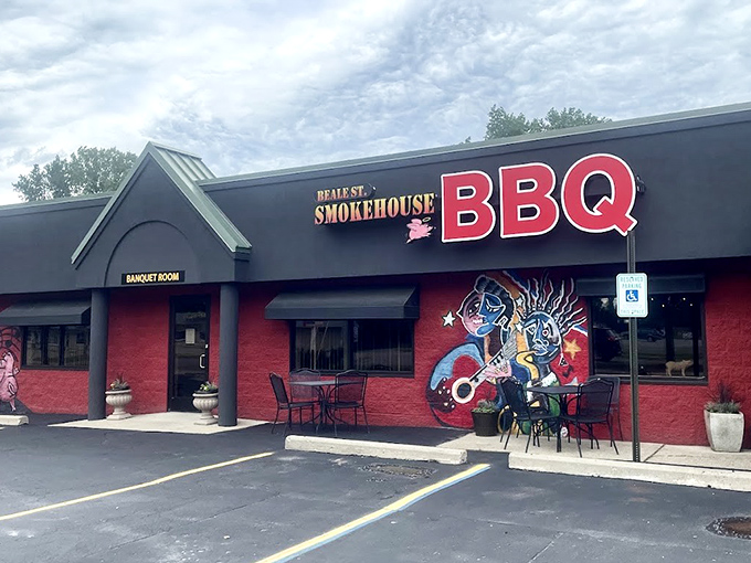 That colorful mural isn't just decoration – it's a promise of the smoky adventures waiting inside this Fenton barbecue haven.