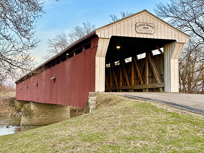 The classic red siding and white-trimmed portals of the Eldean Bridge create that perfect "you've arrived somewhere special" moment as you approach this 1860 treasure.