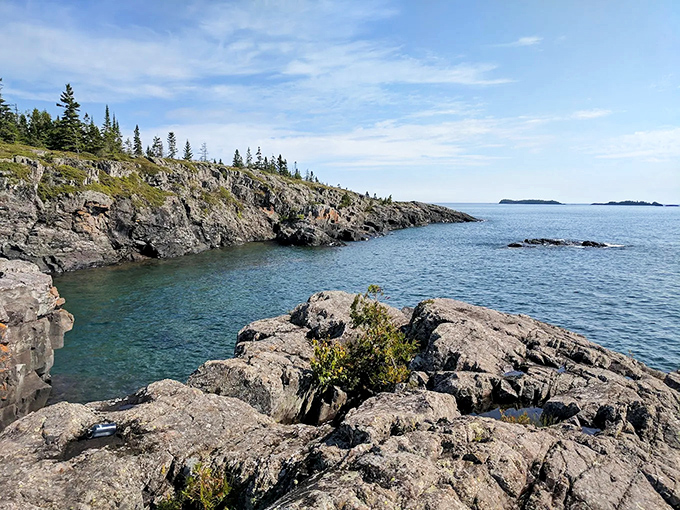Nature's perfect balancing act: rugged shorelines meet crystal waters at Isle Royale, where Lake Superior's vastness makes your problems seem delightfully insignificant.
