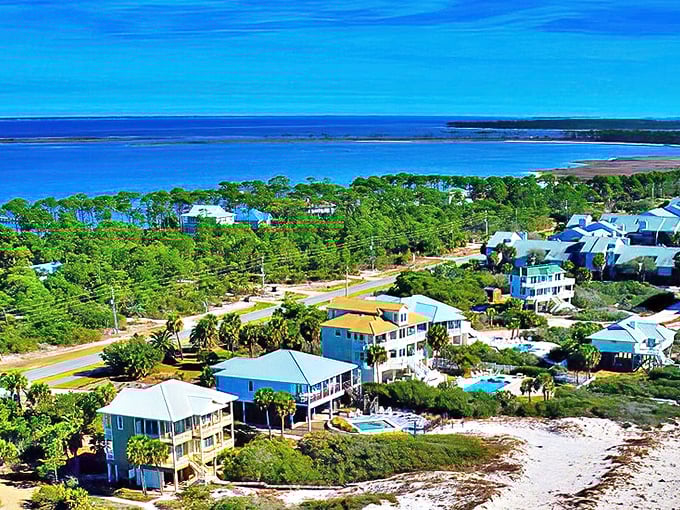 The Cape St. George Lighthouse stands sentinel over sugar-white beaches, a postcard-perfect reminder that some Florida treasures remain blissfully uncommercialized.
