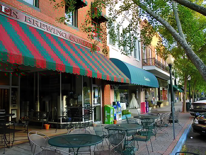 Aiken Brewing Company's iconic red and green awning isn't just eye-catching—it's a beacon for thirsty travelers seeking craft beer and conversation on Laurens Street.