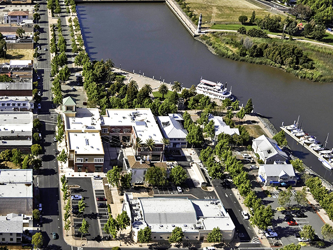 From this bird's-eye view, Suisun City looks like someone designed the perfect small town waterfront for a movie set—except it's gloriously real. 