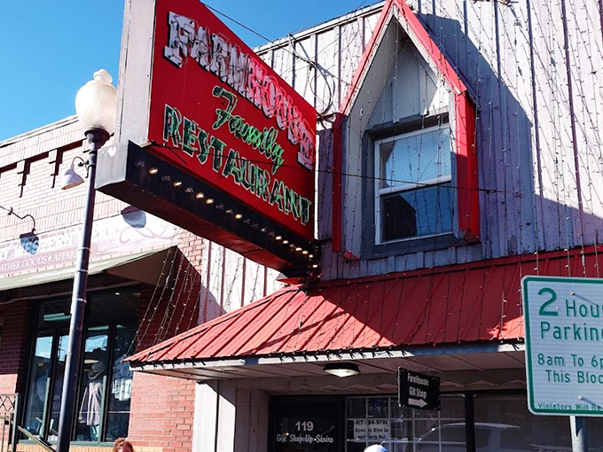 The unassuming exterior with its weathered siding and bright red roof promises something authentic – a culinary hideaway where locals gather and tourists stumble upon greatness.