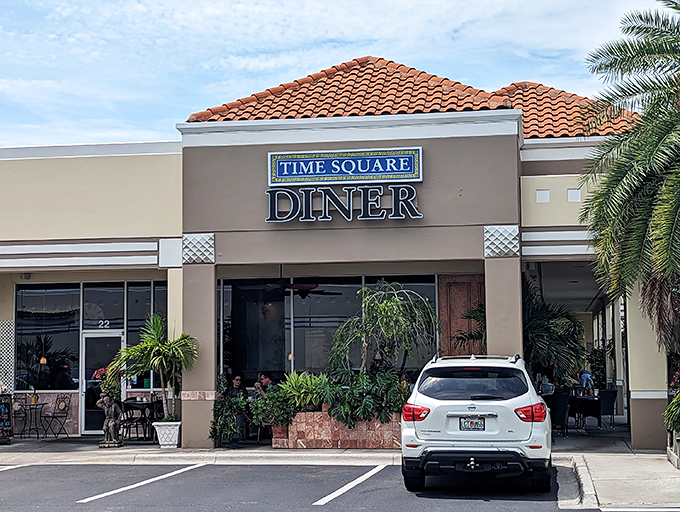 The unassuming exterior of Time Square Diner hides culinary treasures within. Florida palm trees stand guard at this Melbourne gem.