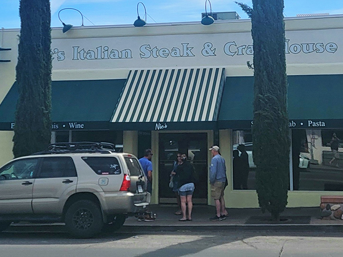 The green-striped awning beckons like an old friend, promising Italian comfort in the Arizona desert. Nic's exterior might be modest, but culinary treasures await inside.
