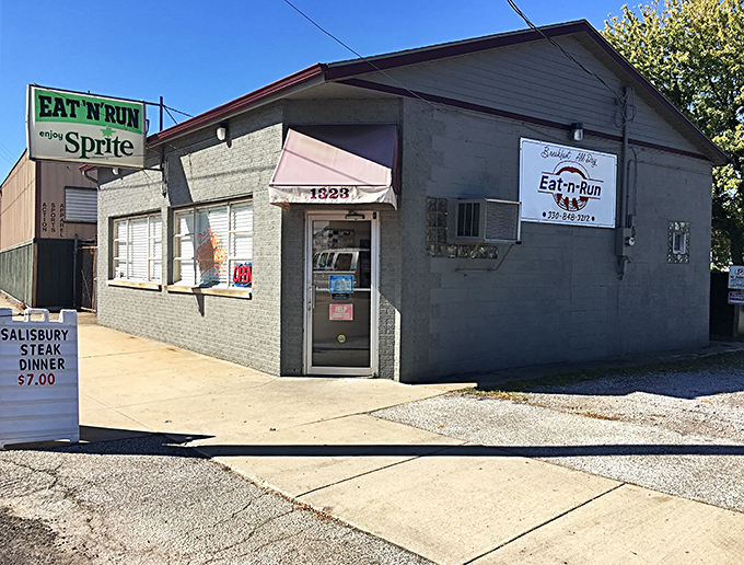 The unassuming exterior of Eat-N-Run might not win architectural awards, but that vintage Sprite sign promises something timeless waiting inside. Culinary treasures often hide in plain sight.