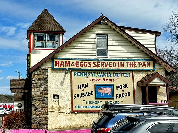 The stone-and-wood exterior of Hickory Valley Farm Restaurant stands as a rustic beacon of comfort food, complete with that unmistakable pink foundation that says, "Yes, we're serious about our brisket."