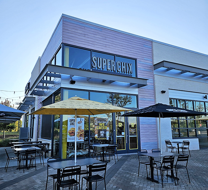 Super Chix's modern exterior with those cheerful yellow umbrellas isn't just inviting—it's practically waving you in for a chicken revelation.