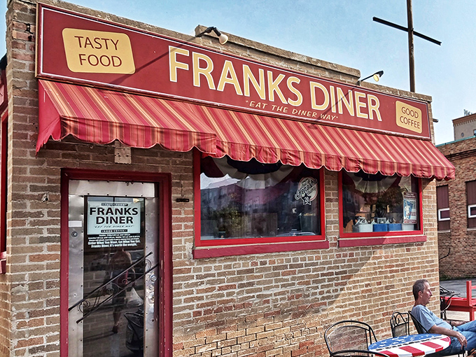 The brick façade and bold red awning of Frank's Diner isn't just inviting—it's practically a time machine disguised as a restaurant in downtown Kenosha. 
